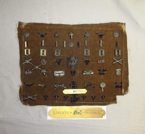 Liberty Insignia Display Board of WWI Insignia. | J. Mountain Antiques